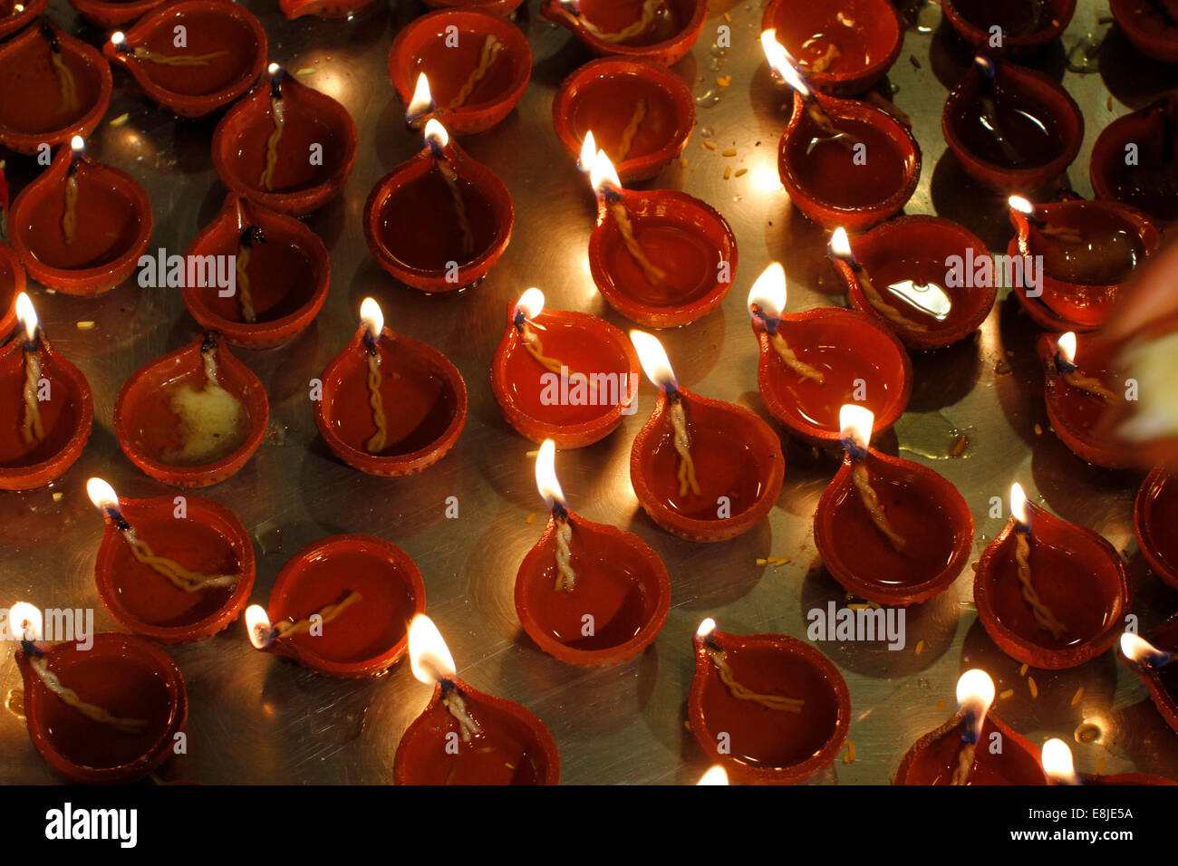 Hindu temple. Offering of lights Stock Photo - Alamy