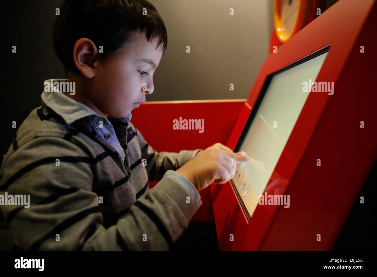 Boy drawing on a computer screen at la CitŽ des Sciences, Paris Stock ...