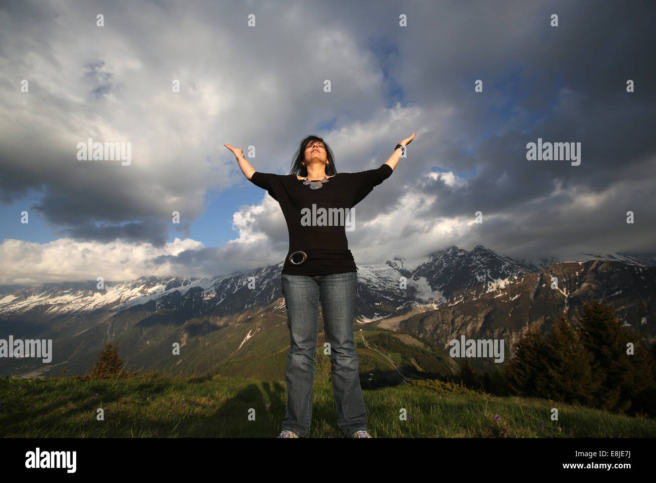 Woman praying outside Stock Photo - Alamy