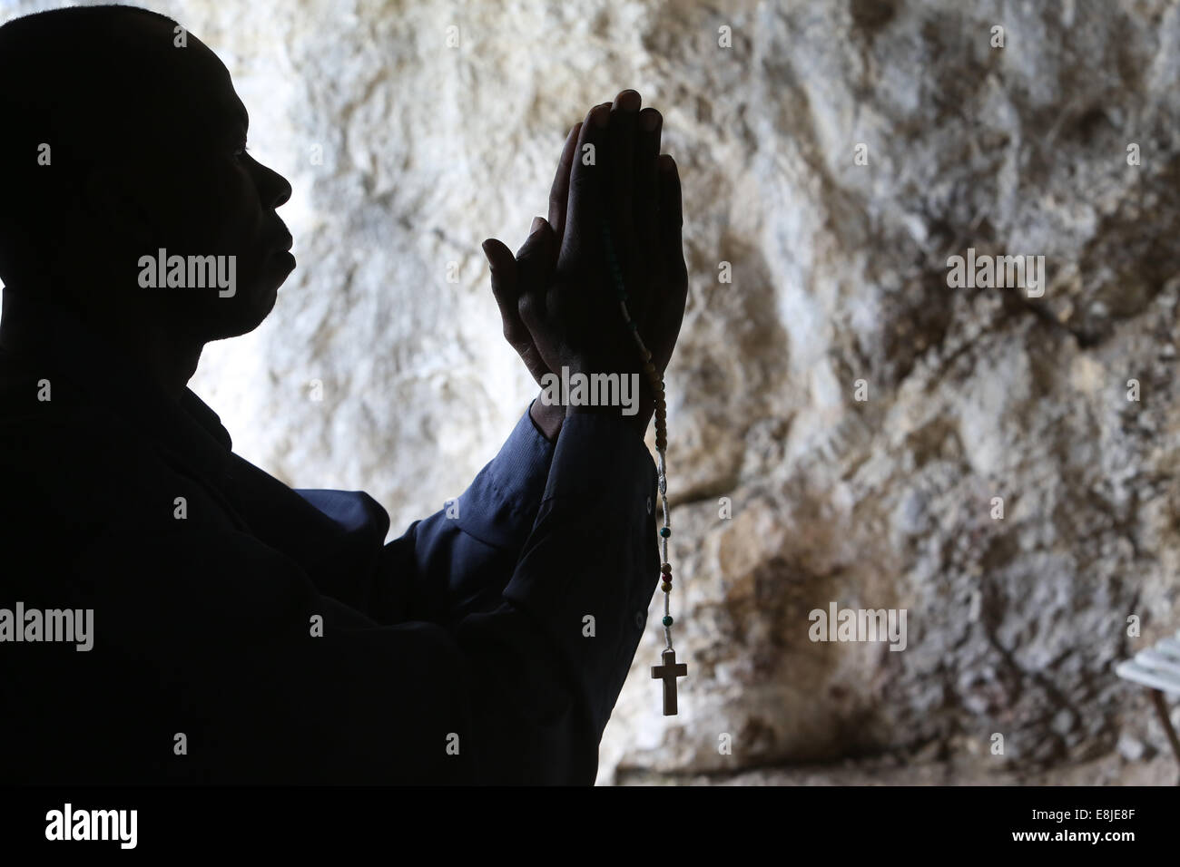 Man praying the rosary Stock Photo - Alamy