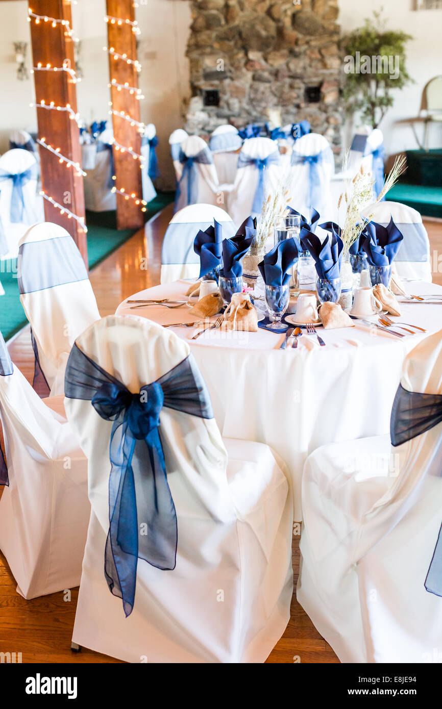 Banquet hall decorated for wedding in white and blue Stock Photo - Alamy