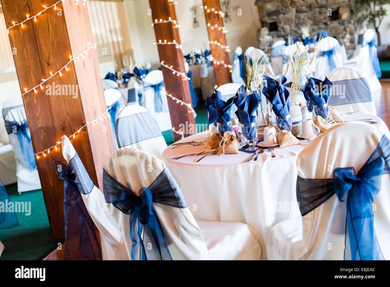 Banquet hall decorated for wedding in white and blue Stock Photo - Alamy