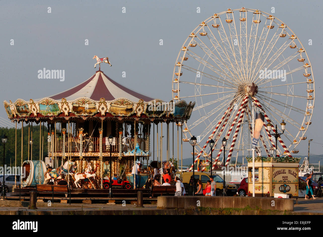 Carousel and ferris wheel Stock Photo - Alamy