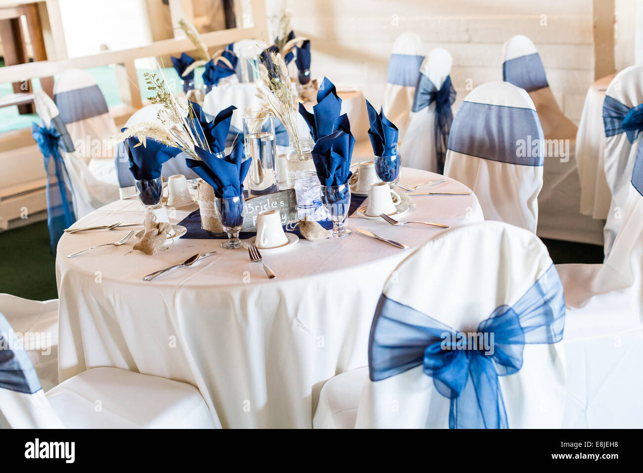 Banquet hall decorated for wedding in white and blue Stock Photo - Alamy
