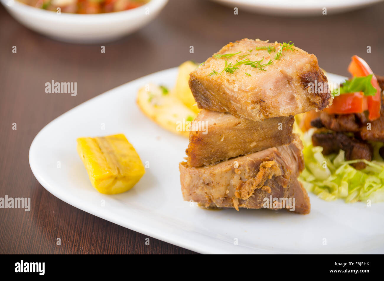 fritada fried pork traditional ecuadorian food Stock Photo - Alamy