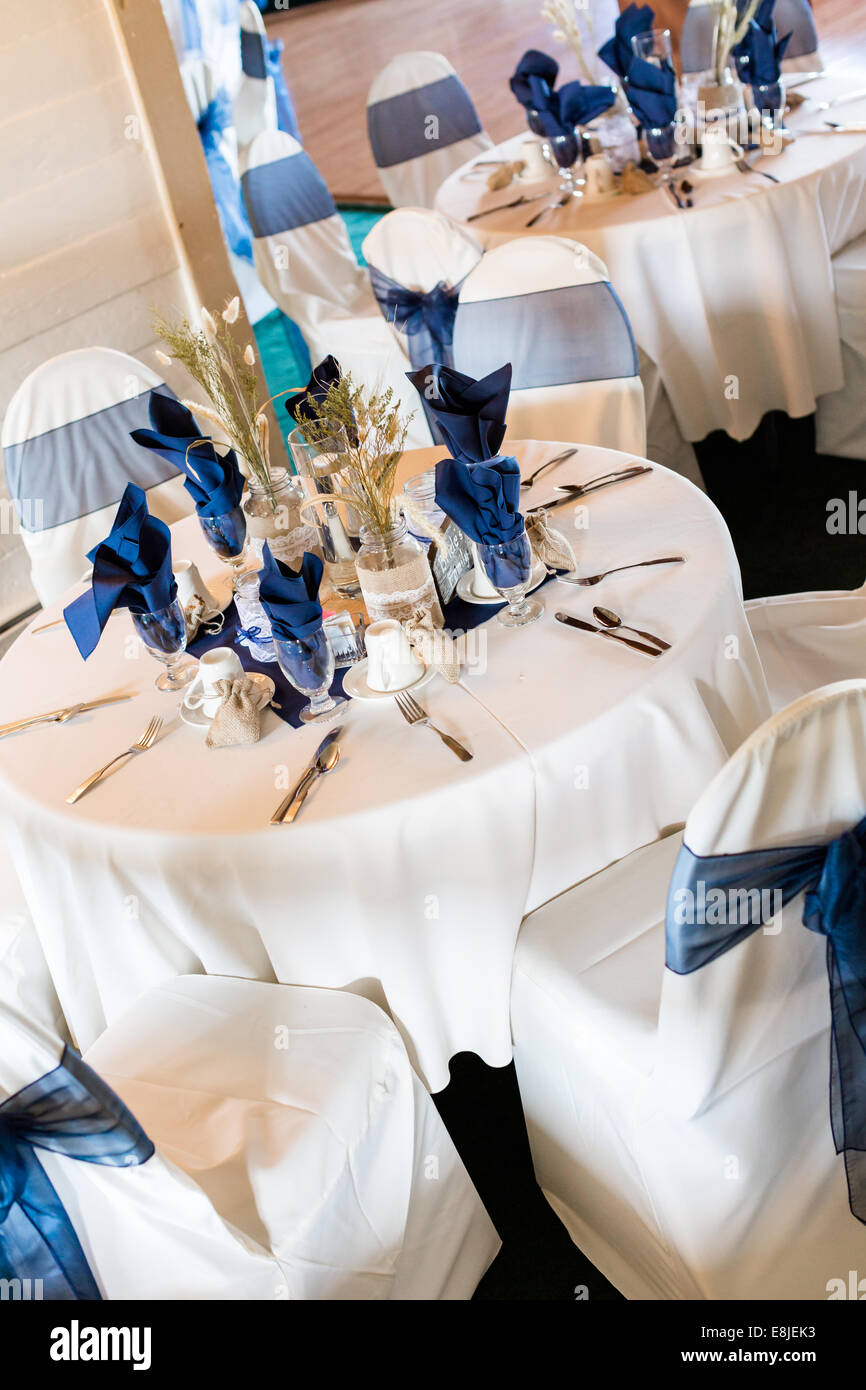 Banquet hall decorated for wedding in white and blue Stock Photo - Alamy