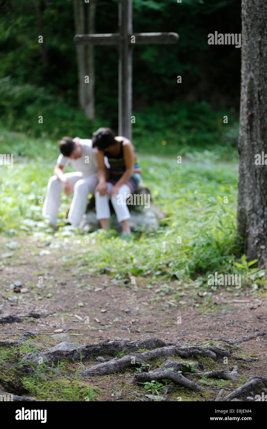 Couple praying together outdoors Stock Photo - Alamy