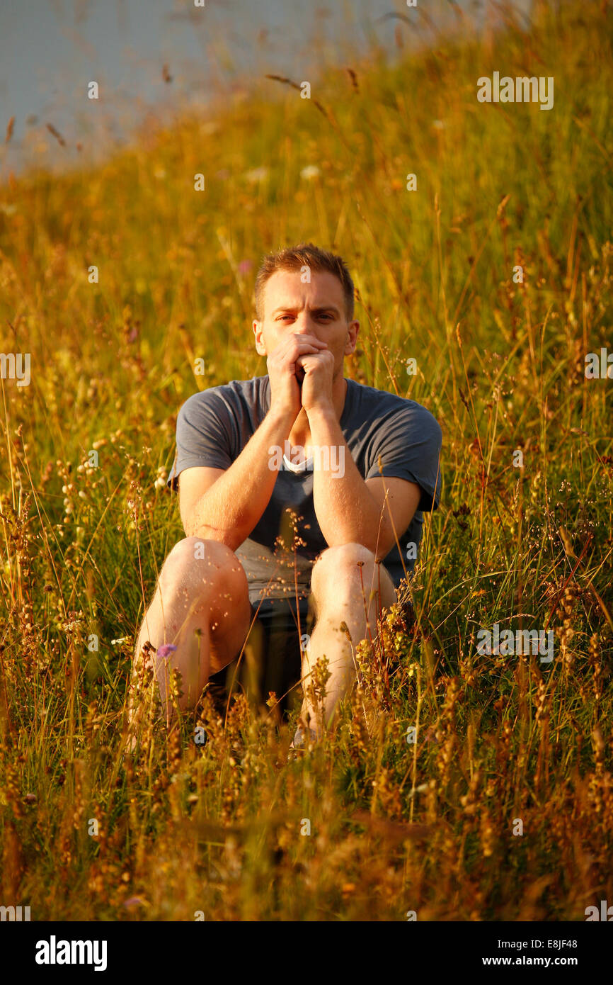 Man praying outside Stock Photo - Alamy