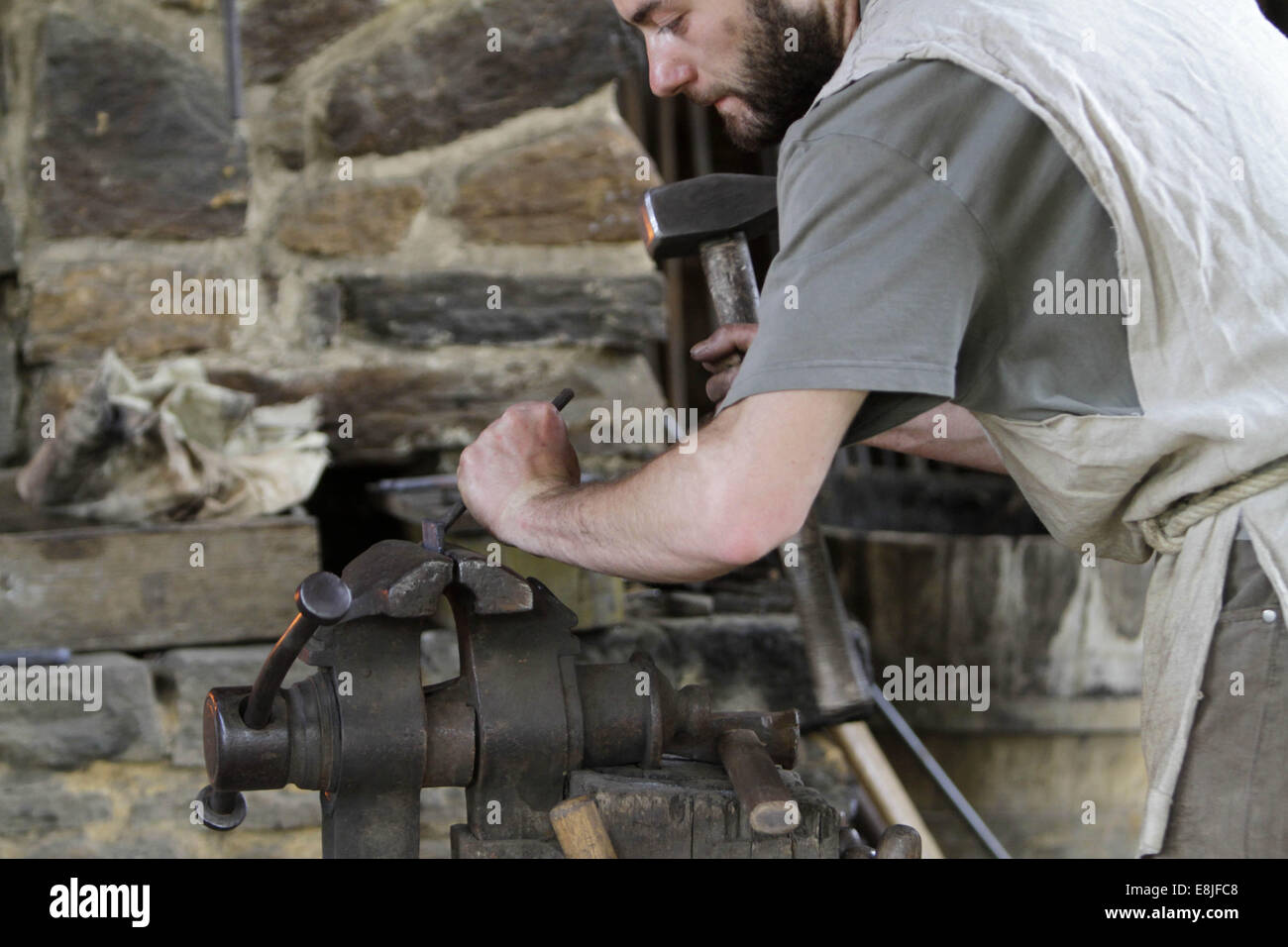 Blacksmith. Medieval site of the castle of GuŽdelon Stock Photo - Alamy