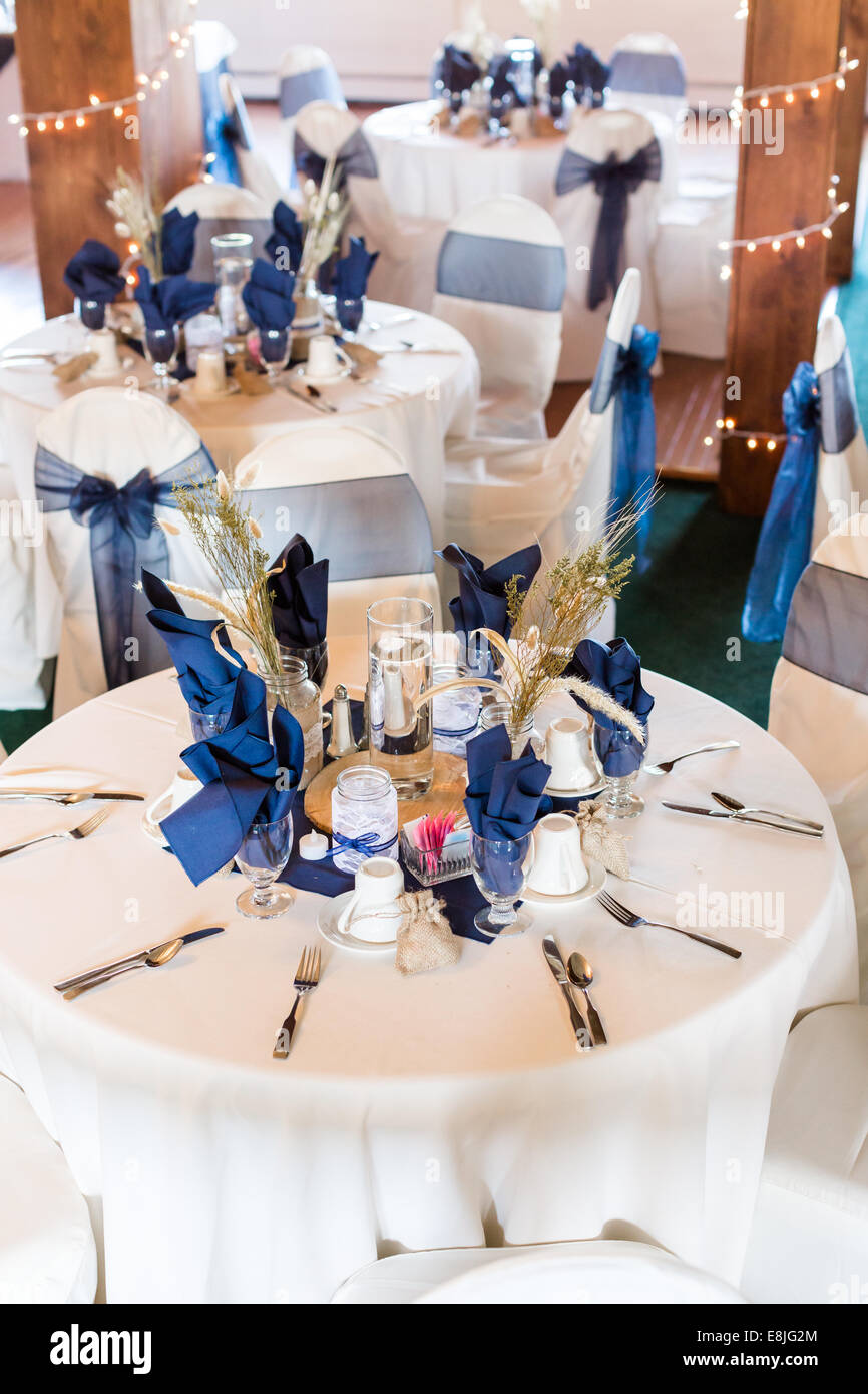 Banquet hall decorated for wedding in white and blue Stock Photo - Alamy