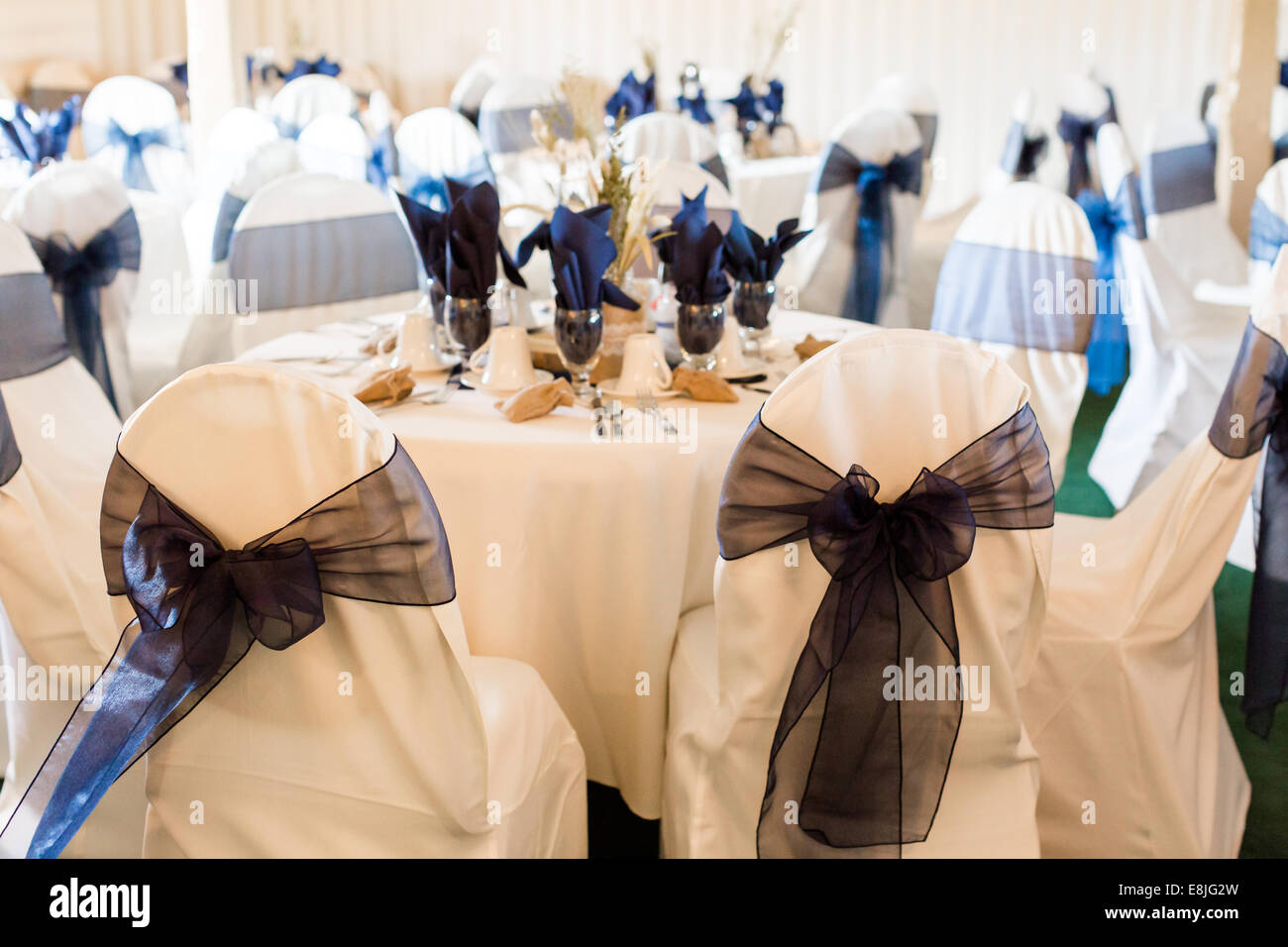 Banquet hall decorated for wedding in white and blue Stock Photo - Alamy