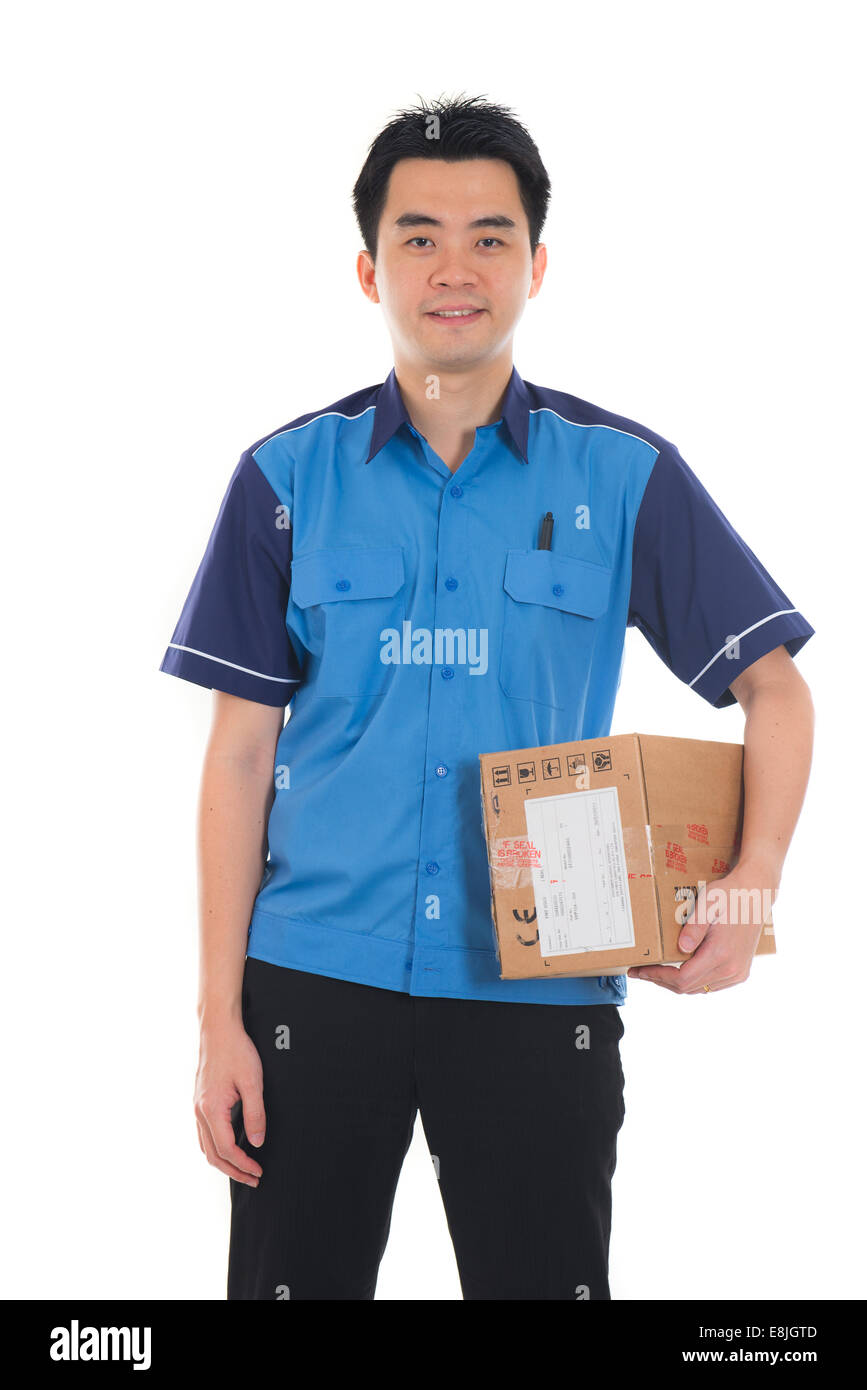 courier in blue uniform sending a package Stock Photo - Alamy