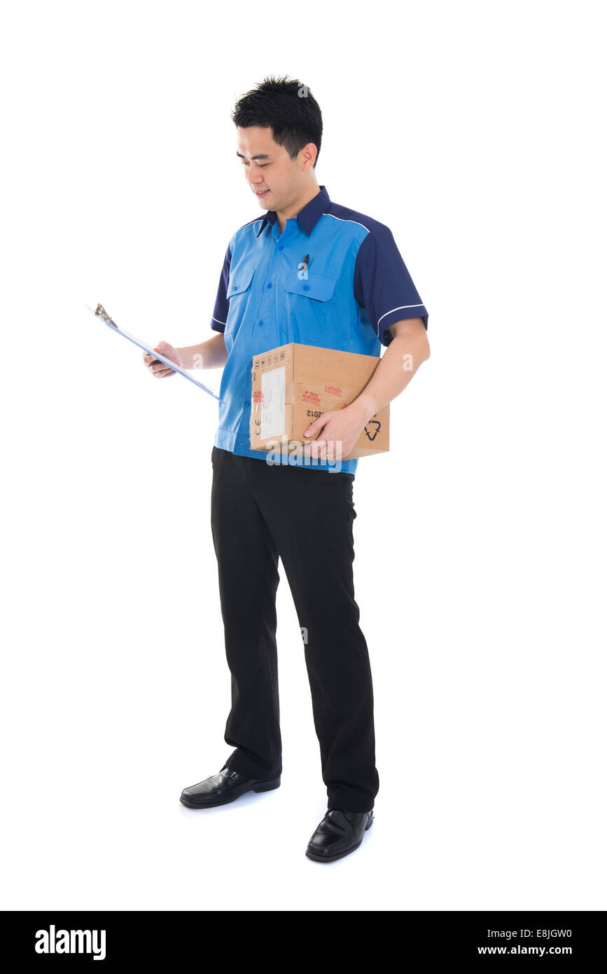 courier in blue uniform sending a package Stock Photo - Alamy