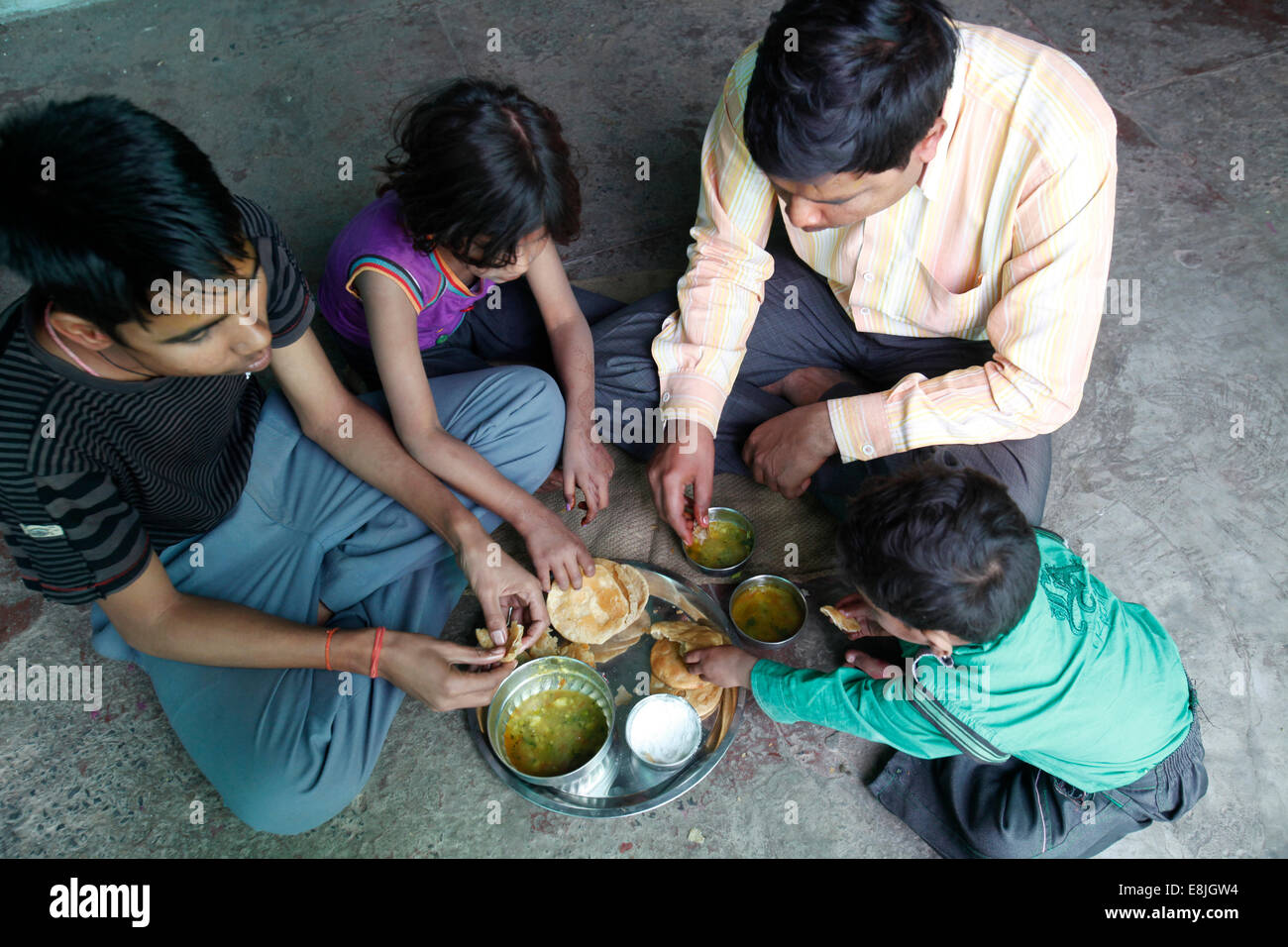 South indian family sitting hi-res stock photography and images - Alamy