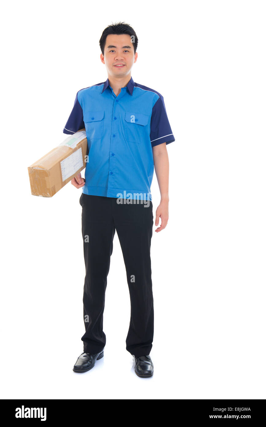 courier in blue uniform sending a package Stock Photo - Alamy