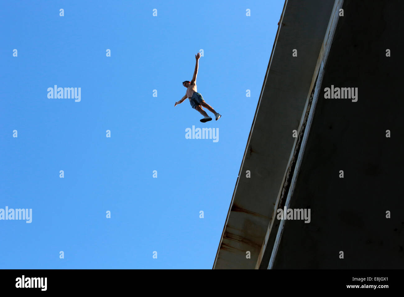 Young man jumping off diving hi-res stock photography and images - Alamy