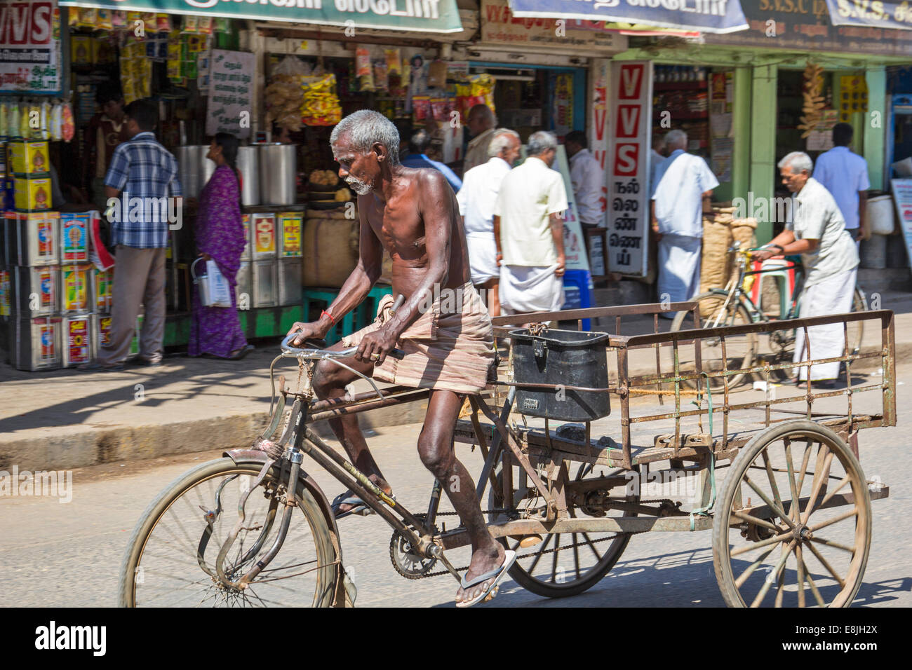 OVERWORKED RICKSHAW DRIVER ON HIS WAY TO ANOTHER VERY HEAVY LOAD INDIA ...