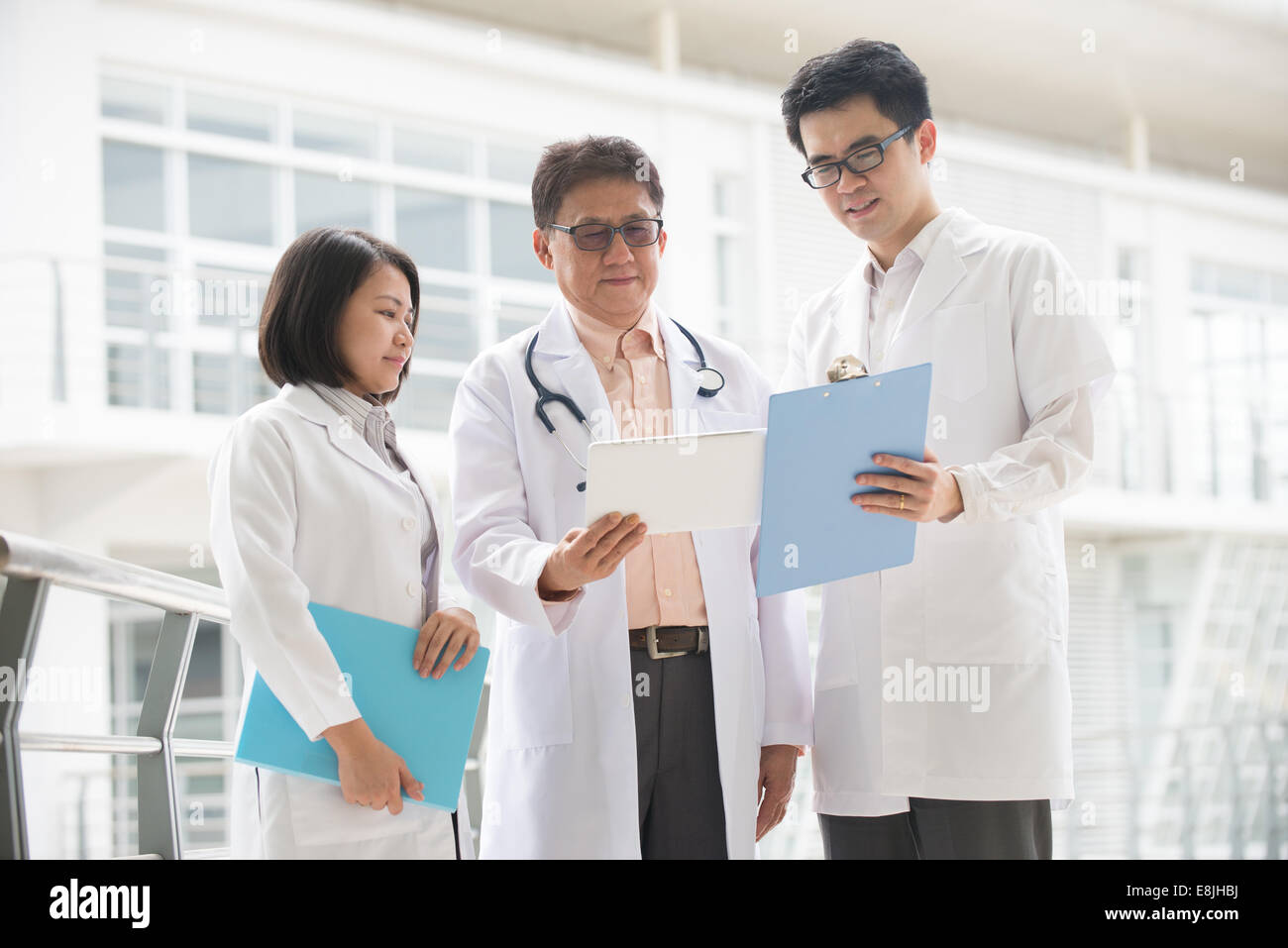 Asian medical team of doctors meeting inside hospital building Stock ...