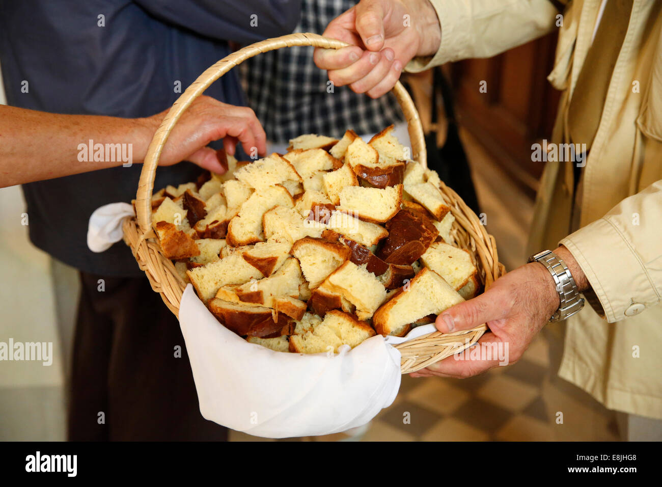 Saint Hubert's mass. Distribution of blessed bread Stock Photo - Alamy