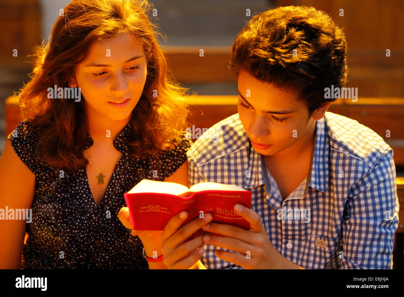 Teenagers reading the Bible in a church Stock Photo - Alamy