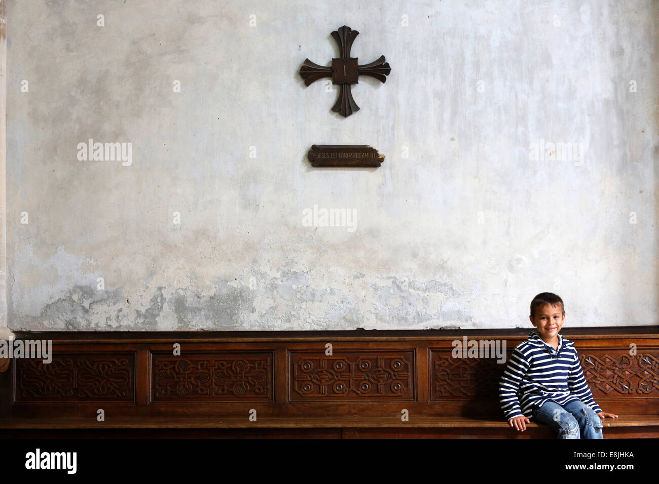 Boy in a catholic church Stock Photo - Alamy