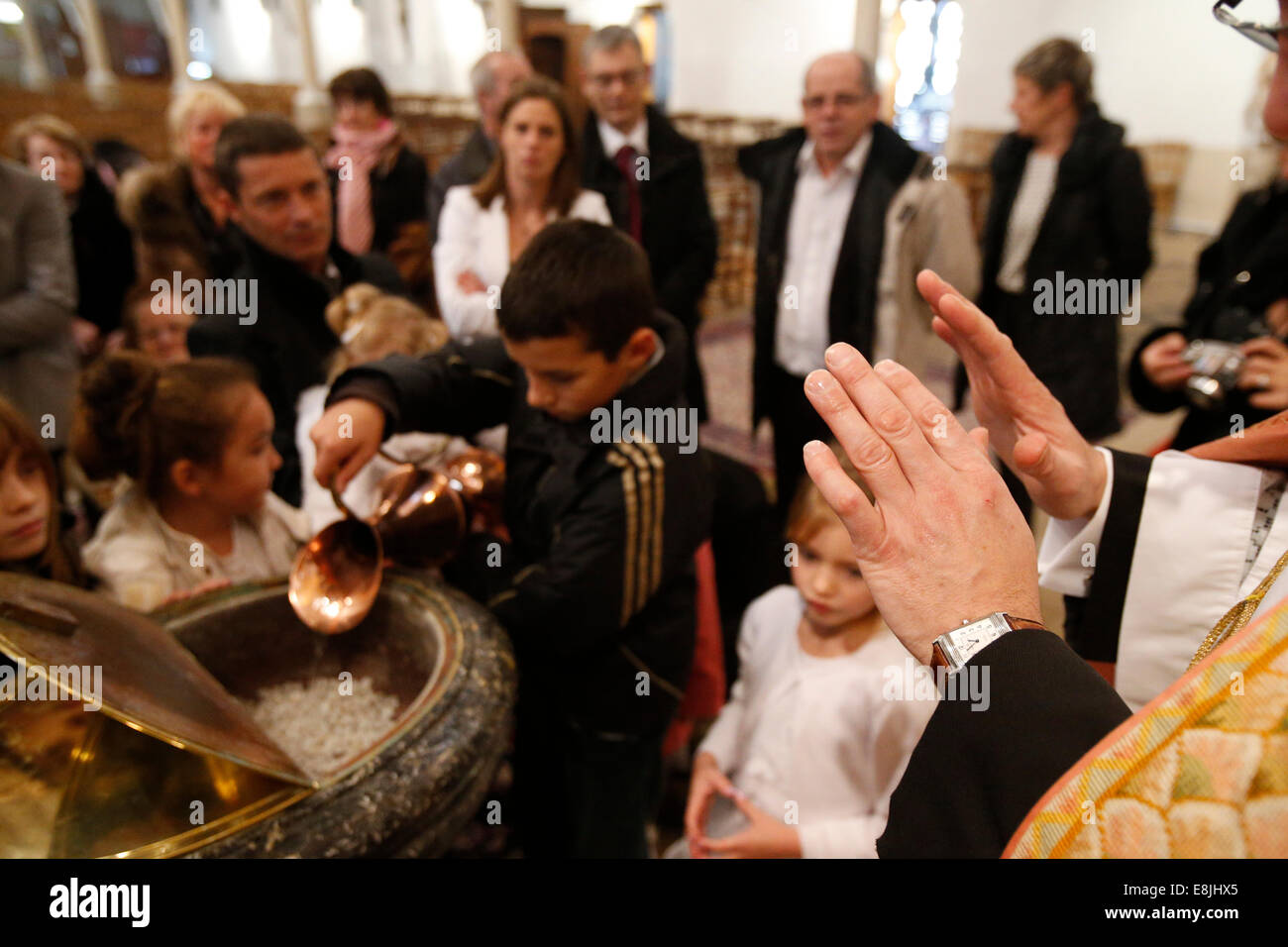 St. Louis church. Baptism. Holy water blessing Stock Photo - Alamy