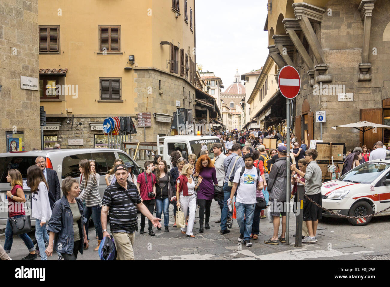 chaotic street scene at south end of Ponte Vecchio as cars struggle ...