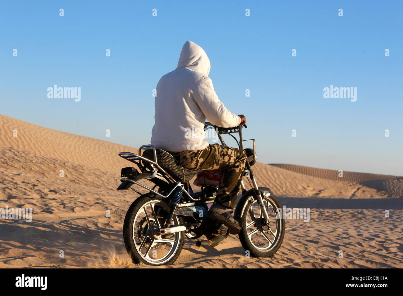 Moped rider in the Sahara Stock Photo - Alamy