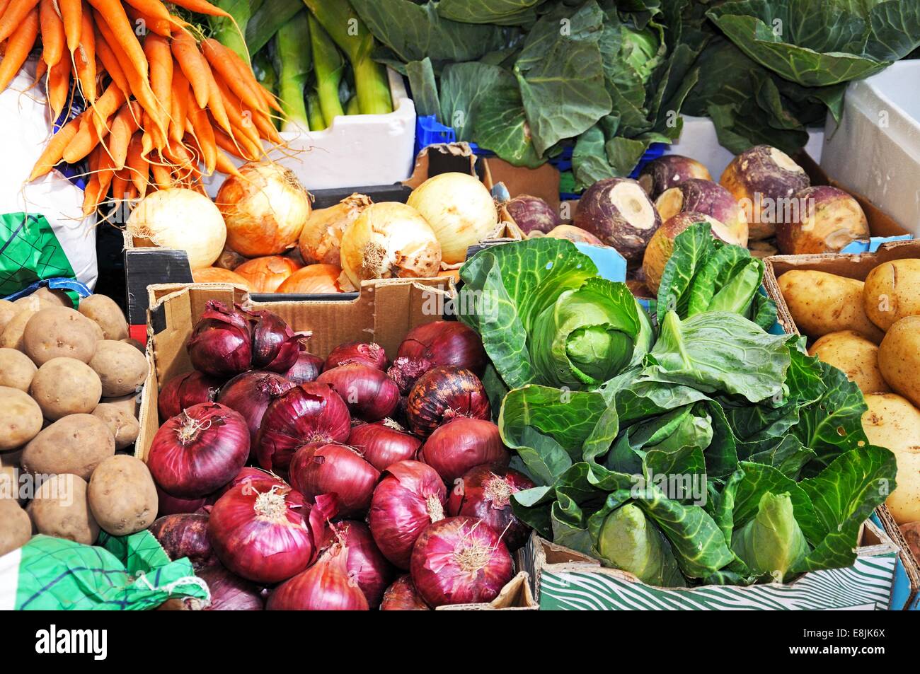 A selection of fresh raw vegetables including, green cabbages, Swedes ...