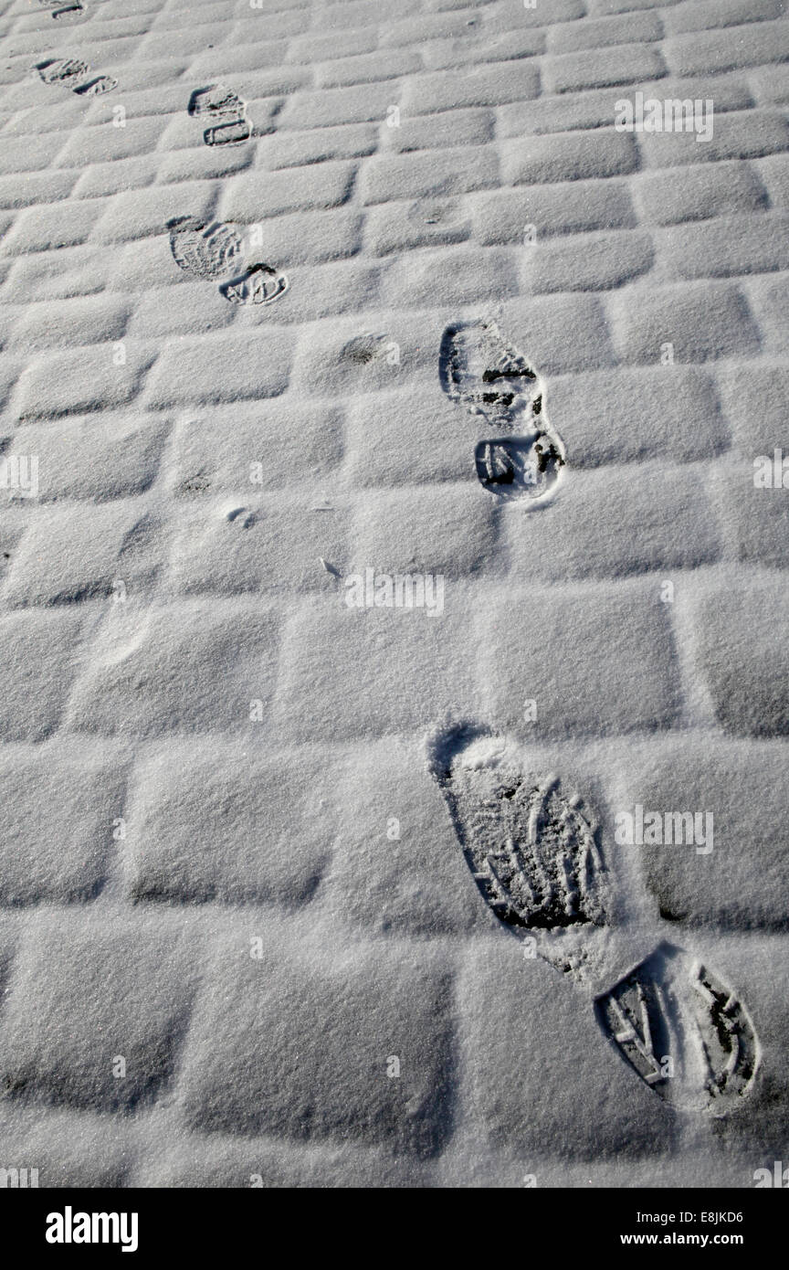 Footprints in snow Stock Photo - Alamy