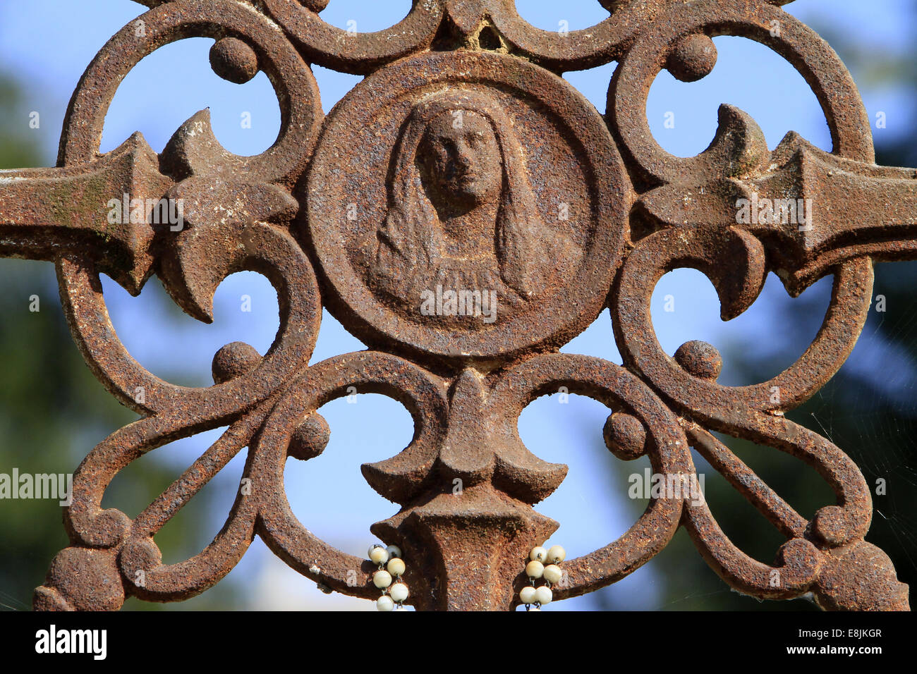 Portrait of the Virgin Mary on a wrought iron cross Stock Photo - Alamy