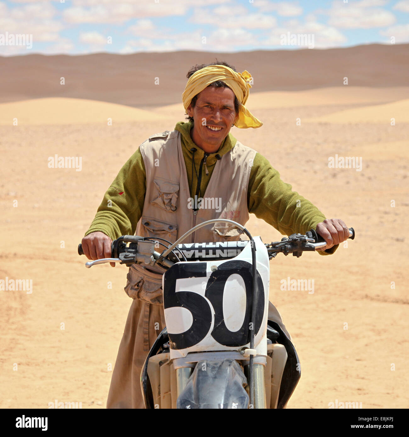 Tunisian riding a motorcycle in the Sahara desert Stock Photo - Alamy