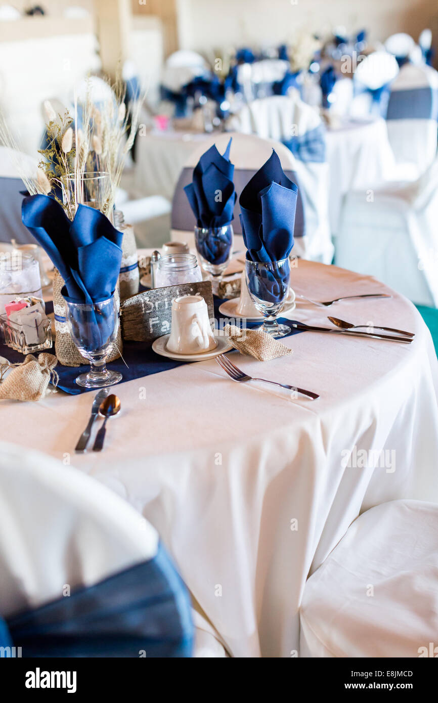 Banquet hall decorated for wedding in white and blue Stock Photo - Alamy
