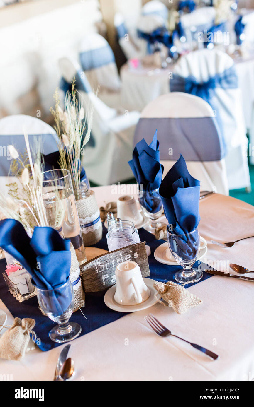 Banquet hall decorated for wedding in white and blue Stock Photo - Alamy