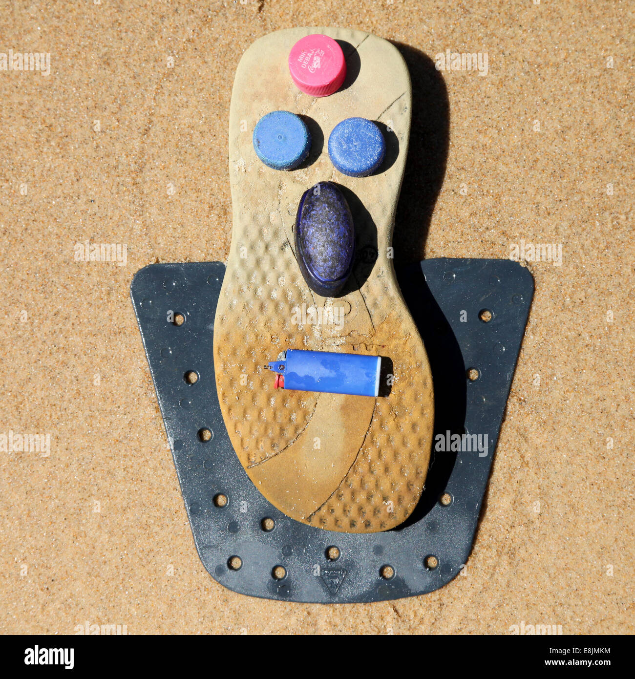 Collage on the sand. Mask Stock Photo - Alamy
