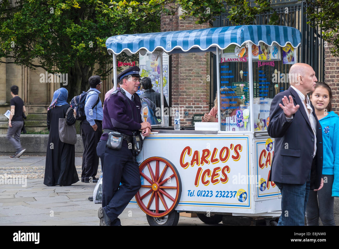 Civil enforcement officer talking to vendor at Carlo's ices stand ...