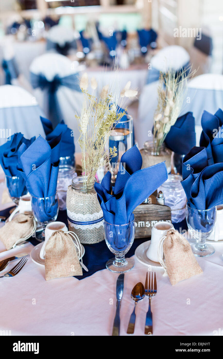 Banquet hall decorated for wedding in white and blue Stock Photo - Alamy