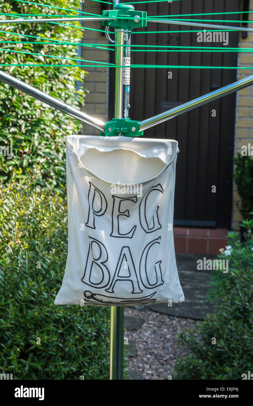 Peg bag hanging on rotary washing line Stock Photo - Alamy
