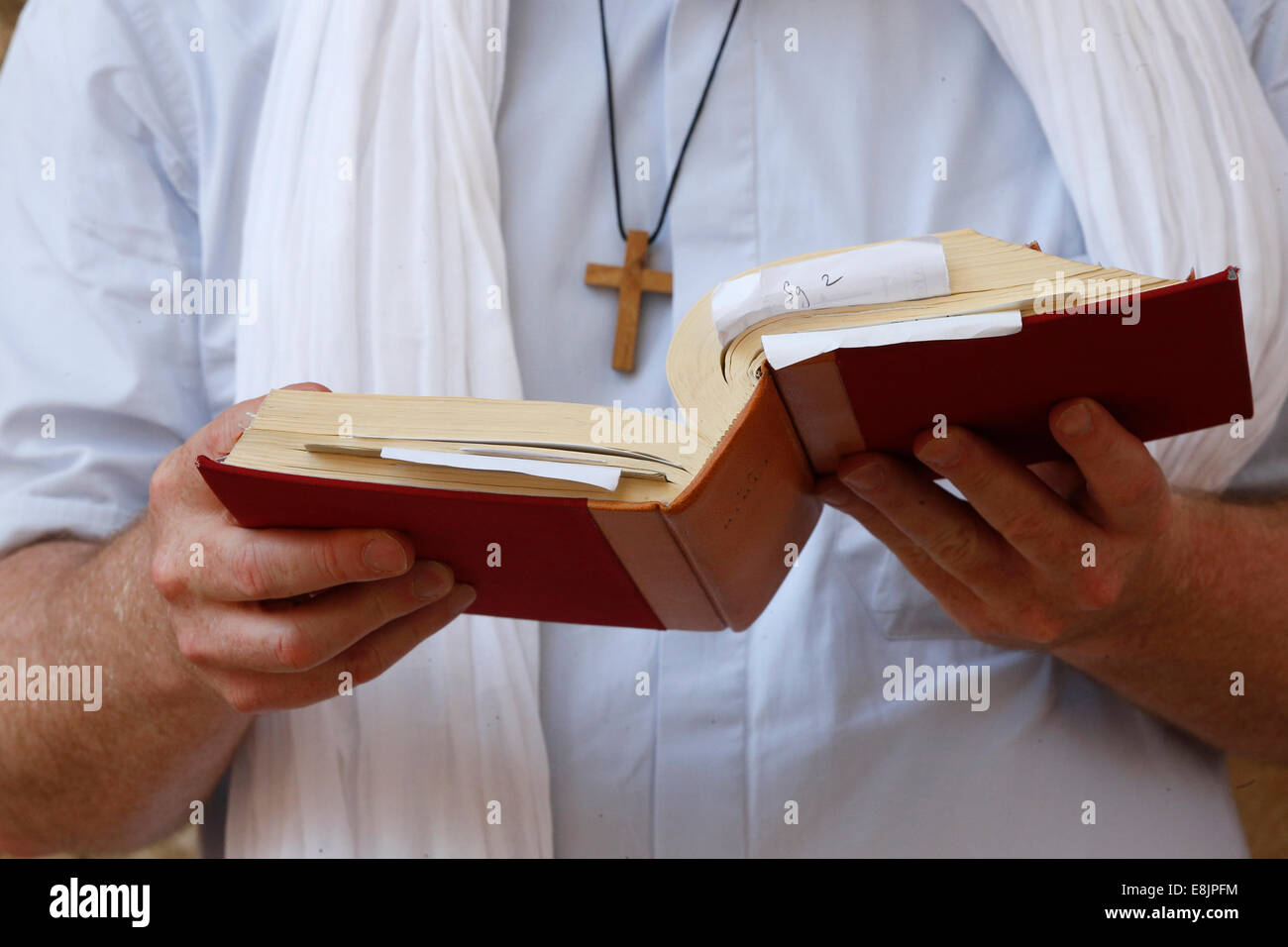 Priest reading the bible Stock Photo - Alamy