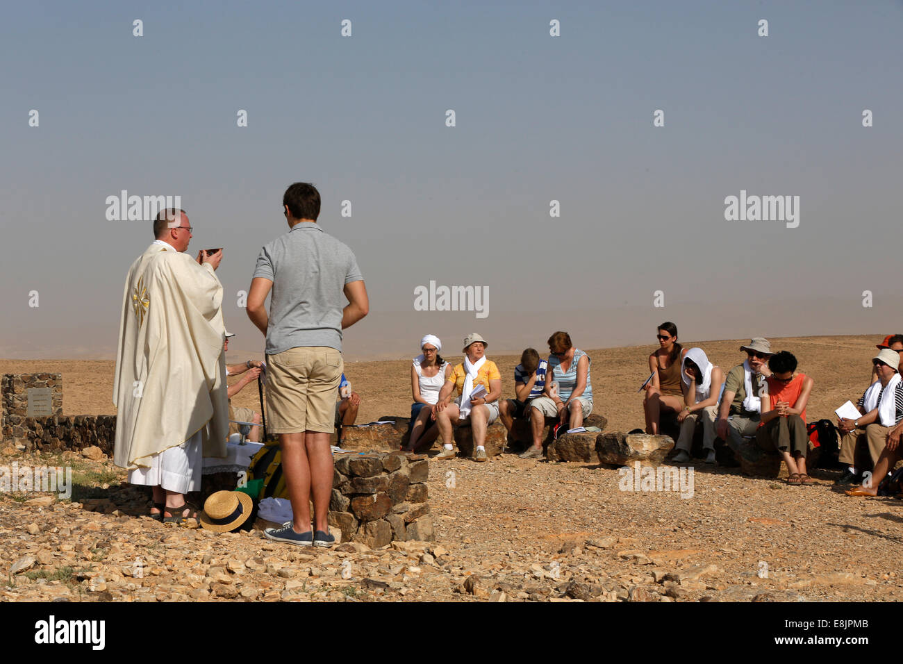 Pilgrimage in Holy Land. Catholic mass in Judean desert Stock Photo - Alamy