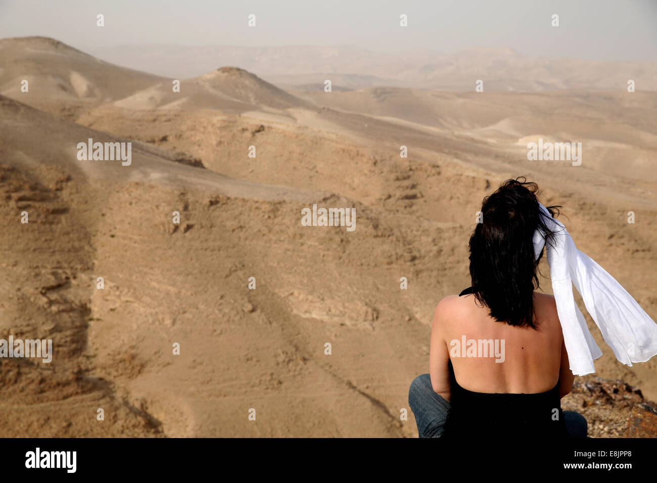 Pilgrimage in Holy Land. Woman praying in Judean desert Stock Photo - Alamy