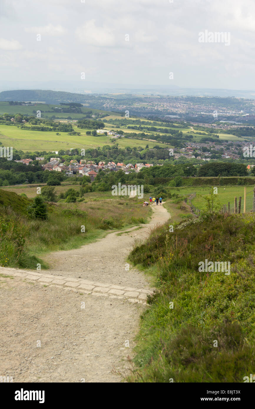 A group of young men walking down the path from Darwen Hill towards the ...