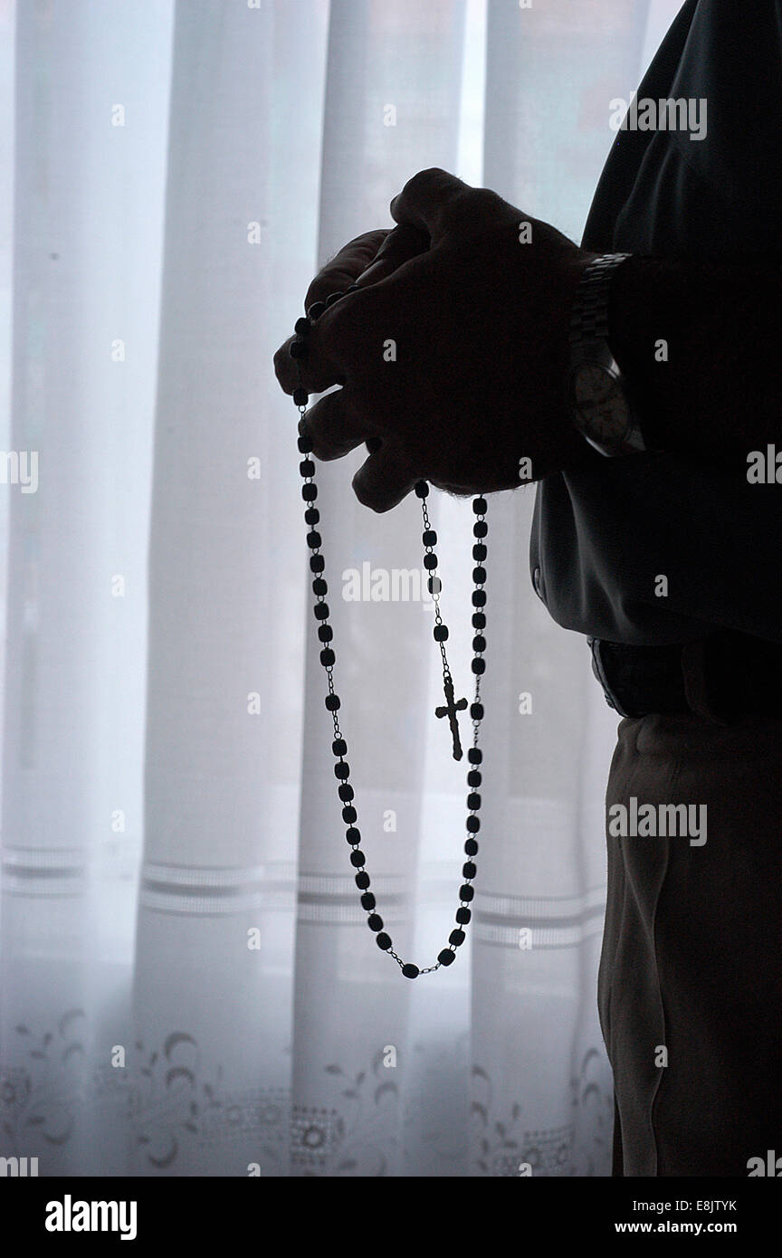 The rosary priest hi-res stock photography and images - Alamy