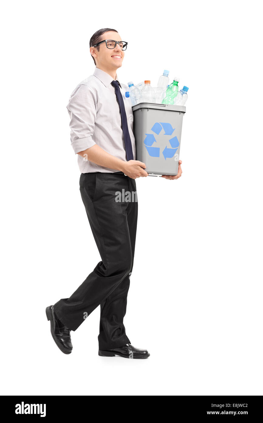 Full length portrait of a young man carrying a recycle bin isolated on ...