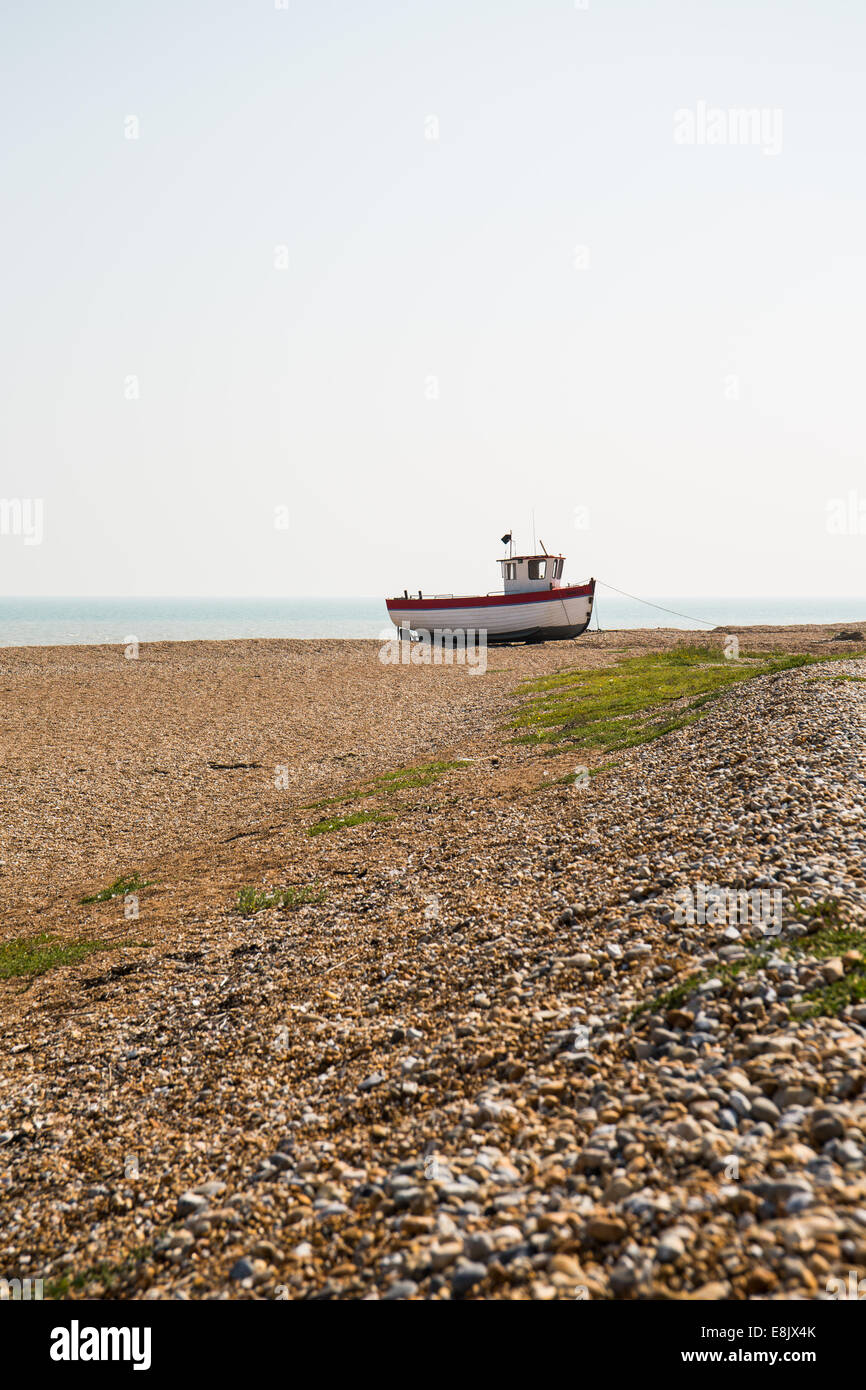 fishing boat on a shingle beach Stock Photo - Alamy