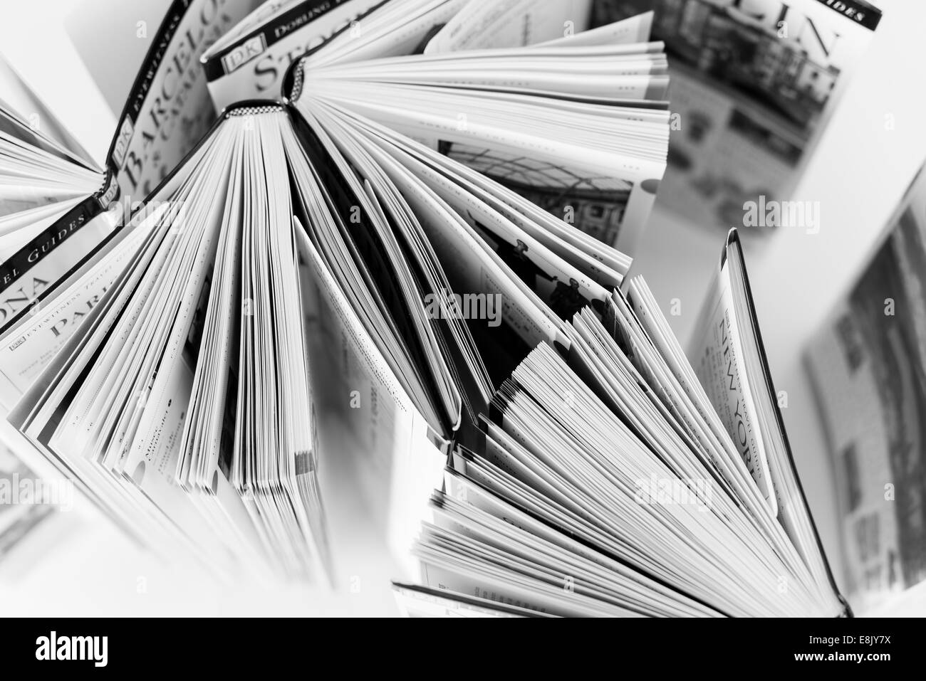 open books in fan shape, photographed from above, DK city guides, white ...