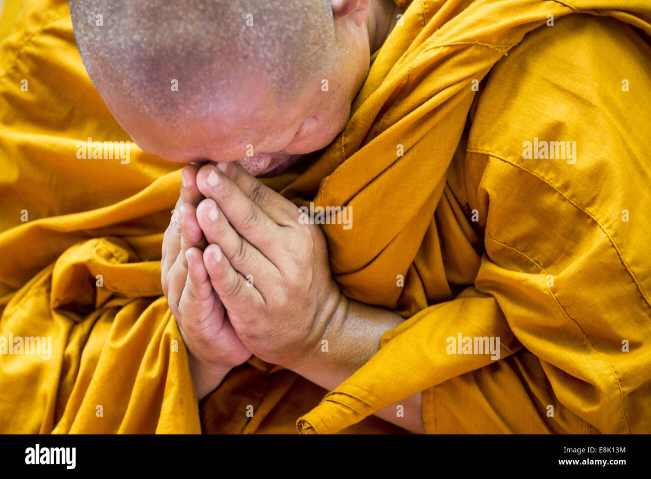 Bangkok, Thailand. 9th Oct, 2014. A Buddhist monk prays for the King of ...