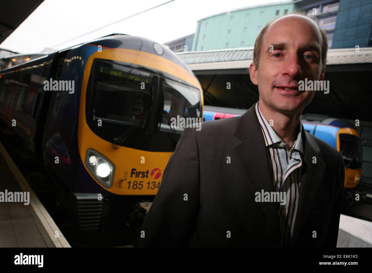 Transport Minister Andrew Adonis before boarding a train at Manchester ...