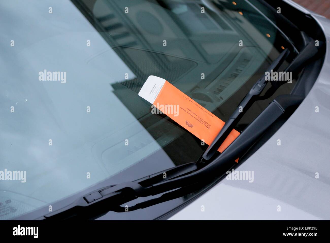 Parking ticket on windshield of car Stock Photo - Alamy