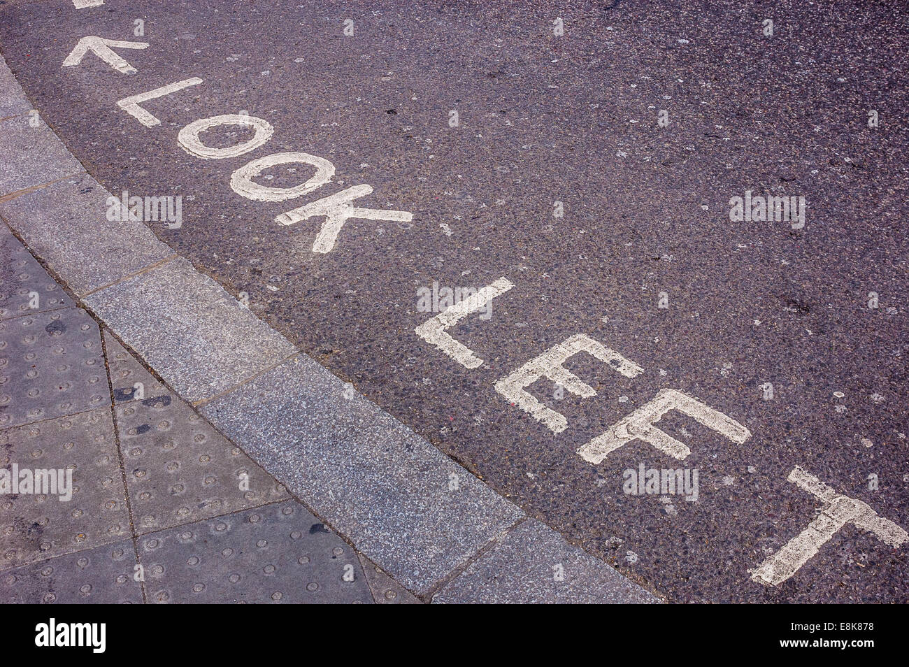 A look left sign on a road in London England Stock Photo - Alamy